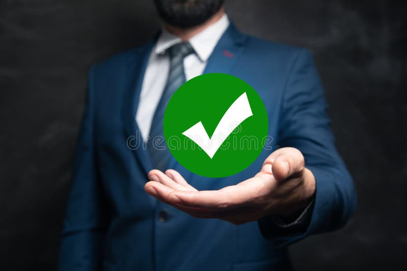 Man Holding a Check Mark Icon in His Hand Stock Photo - Image of ...