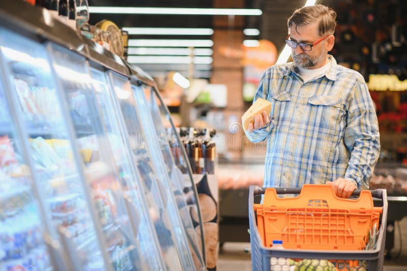 Bearded Man with Frozen Fish His Hands Stands at the Refrigerator in ...
