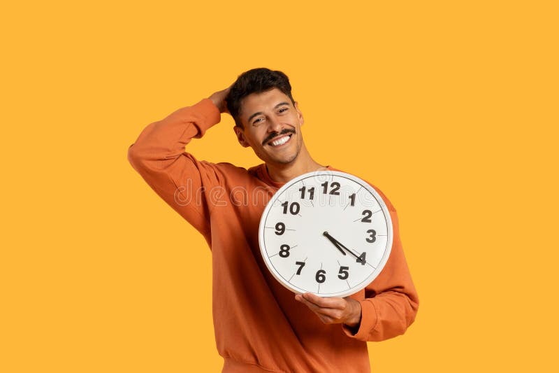 Man Holding Clock in Front of His Face Stock Image - Image of clock ...