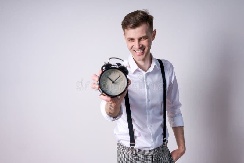 A Man is Holding a Clock and Smiling Stock Image - Image of alarm ...