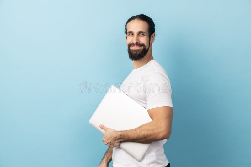 Man Holding Closed Laptop or Folder, Looking at Camera with Kind Look ...