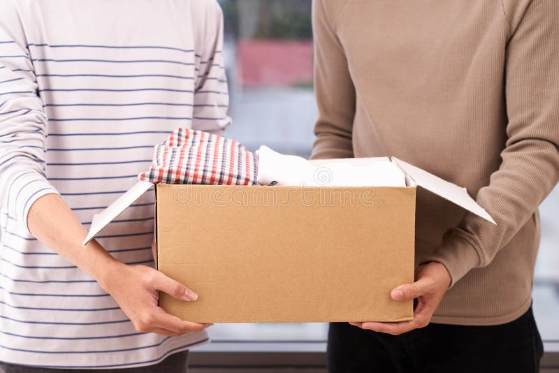 Man Holding a Clothes Donate Box. Donation Concept. Stock Image - Image ... Man Holding a Clothes Donate Box. Donation Concept. Stock Image - Image ...