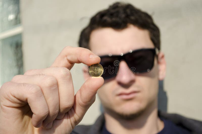 Man holding coin stock image. Image of fingers, euro - 40526949