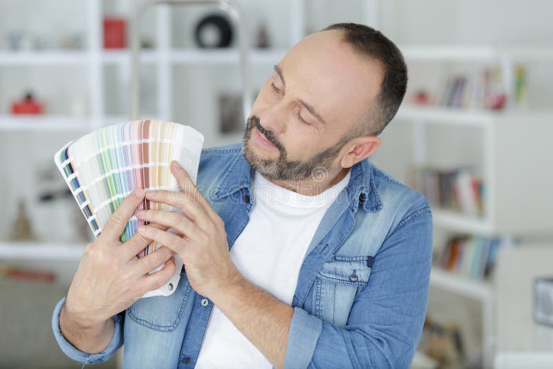 Man holding color swatch stock photo. Image of male - 265996052