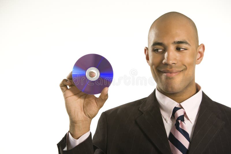 Man holding compact disc. stock photo. Image of indoors - 2425870