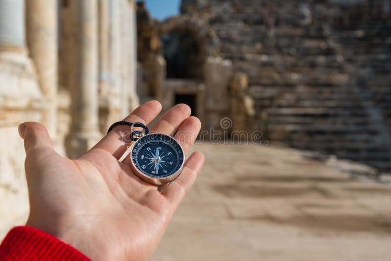 Man Holding Compass in Ancient City Stock Photo - Image of landscape ...