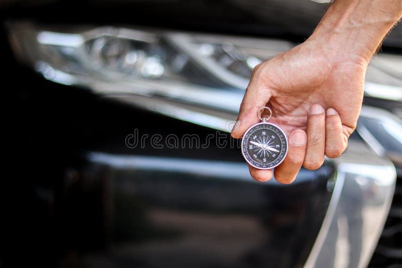 A Man Holding Compass on Black Car Background, Journey of Life Concept ...