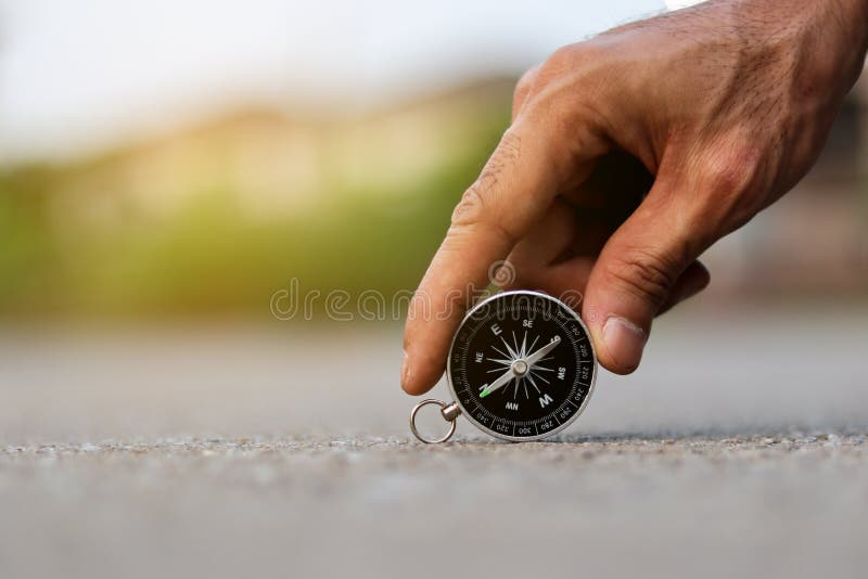 Compass on a road map stock image. Image of road, longitude - 28247439