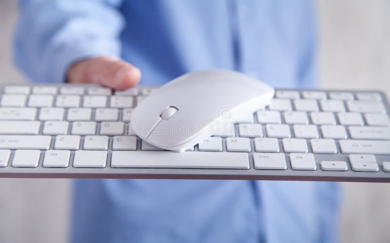 Man Holding Computer Mouse with a Keyboard. Technology, Business Stock ...