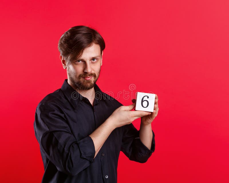 Man Holding a Cube with the Number Six Stock Photo - Image of male ...