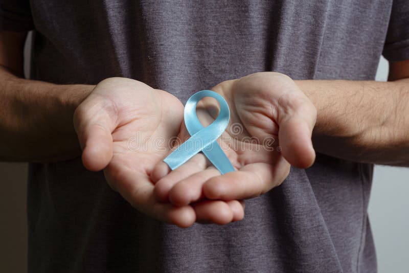 Man Holding Cyan Ribbon. Awareness Ribbon Stock Photo - Image of ...