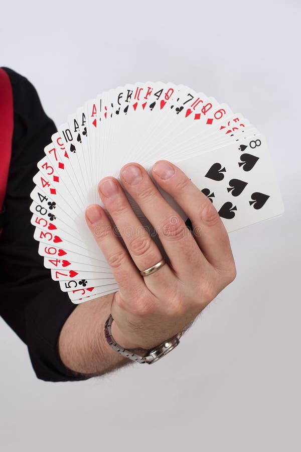 A Man Holding a Deck of Playing Cards Stock Image - Image of horizontal ...