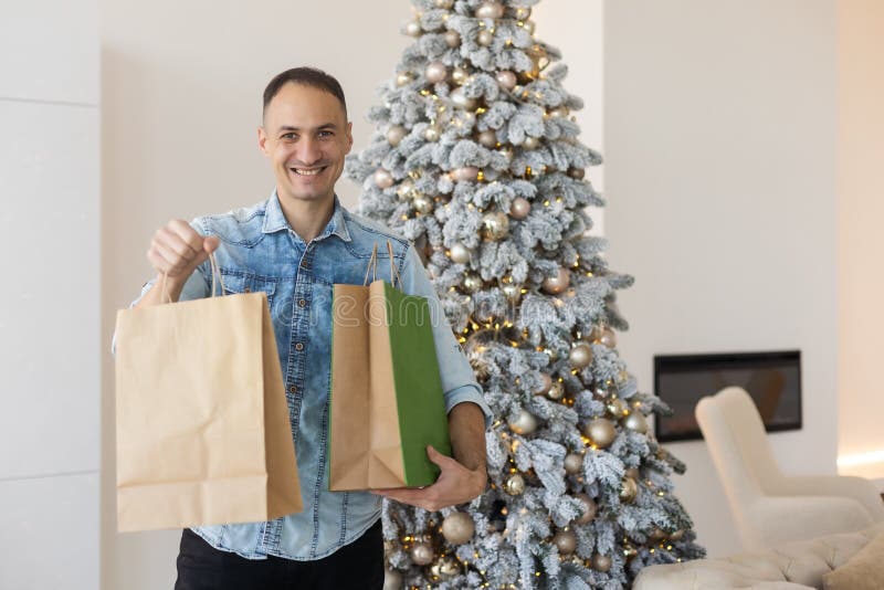 Man Holding Delivery Packages, Christmas. Stock Photo - Image of ...