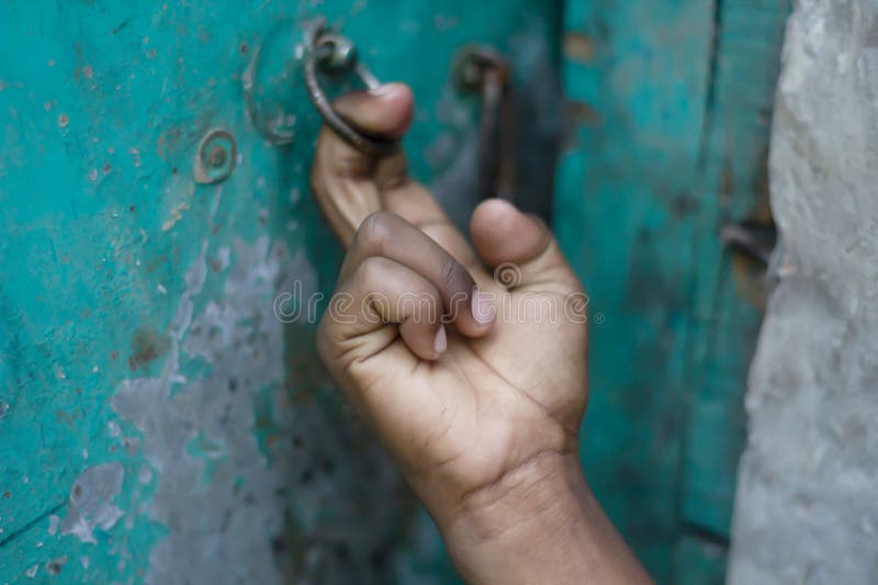 A Man is Holding Door Lock with Hands and Blurred Background Stock ...