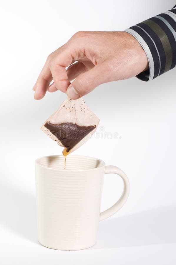 Man Holding Dripping Teabag Stock Image - Image of dripping, beverage ...