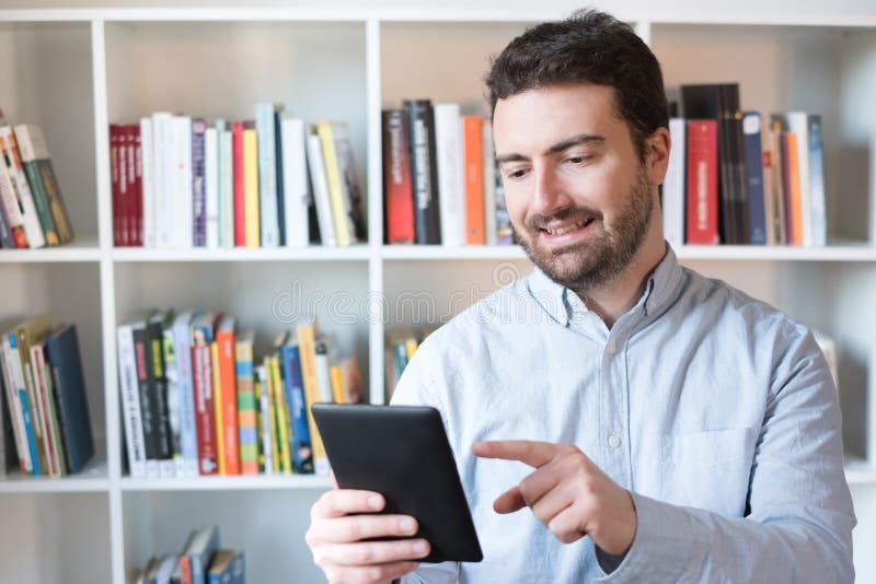 Man Holding an E-book Reader in Hands Stock Image - Image of people ...
