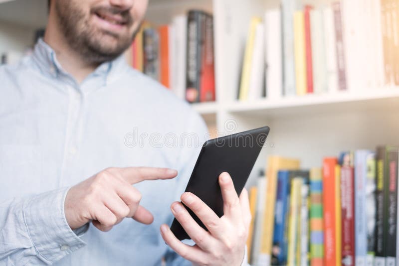 Man Holding an E-book Reader in Hands Stock Photo - Image of reader ...