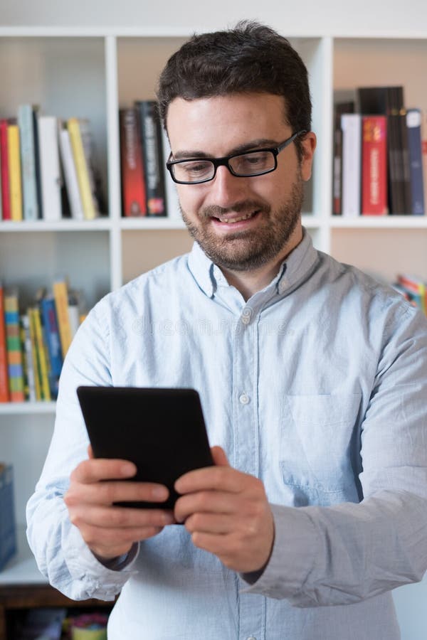 Man Holding an E-book Reader in Hands Stock Image - Image of close ...