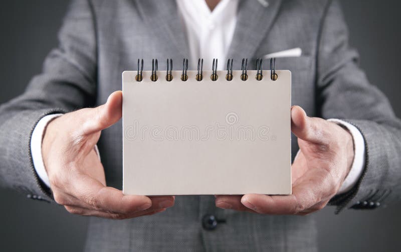 Man Holding Empty Notepad. Space for Your Text Stock Image - Image of ...