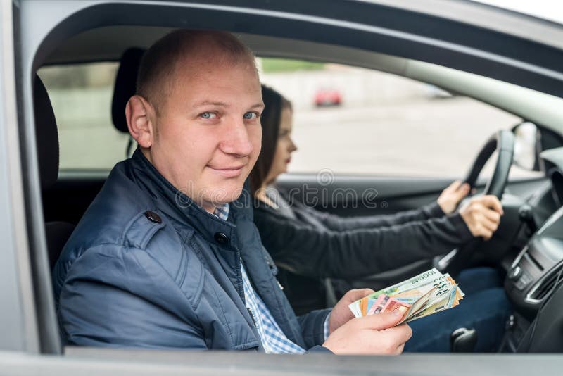 Man Holding Euro Banknotes Sitting in Car Stock Image - Image of ...