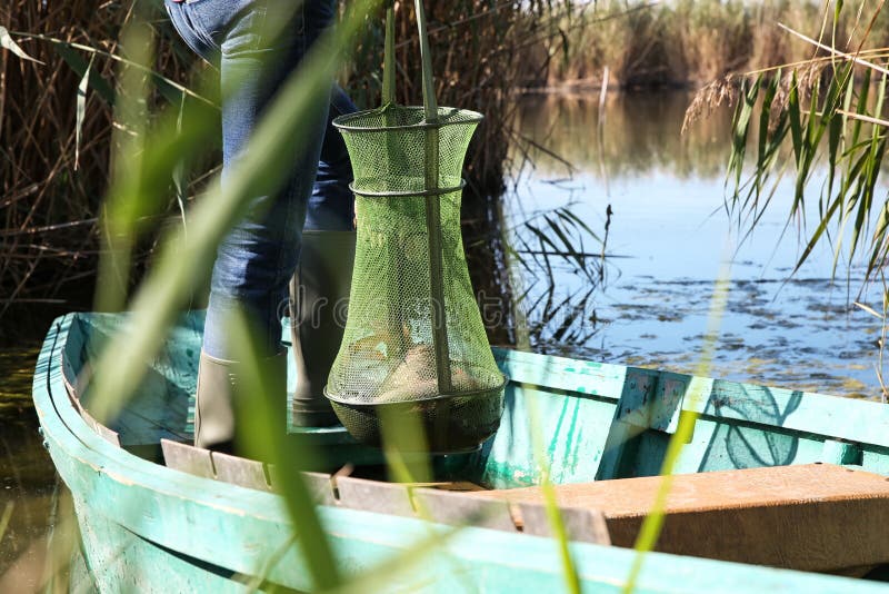 Man Holding Fishing Net with Catch in Boat Stock Photo - Image of ...