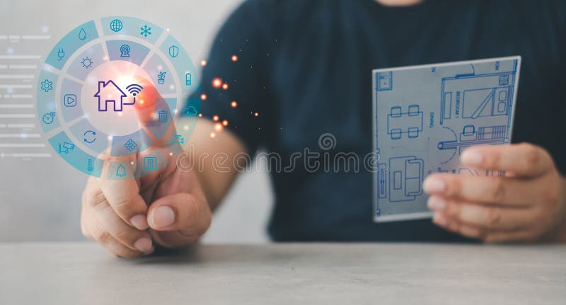 A Man Holding the Floor Plan Blueprint of House and Touch Smart Home ...