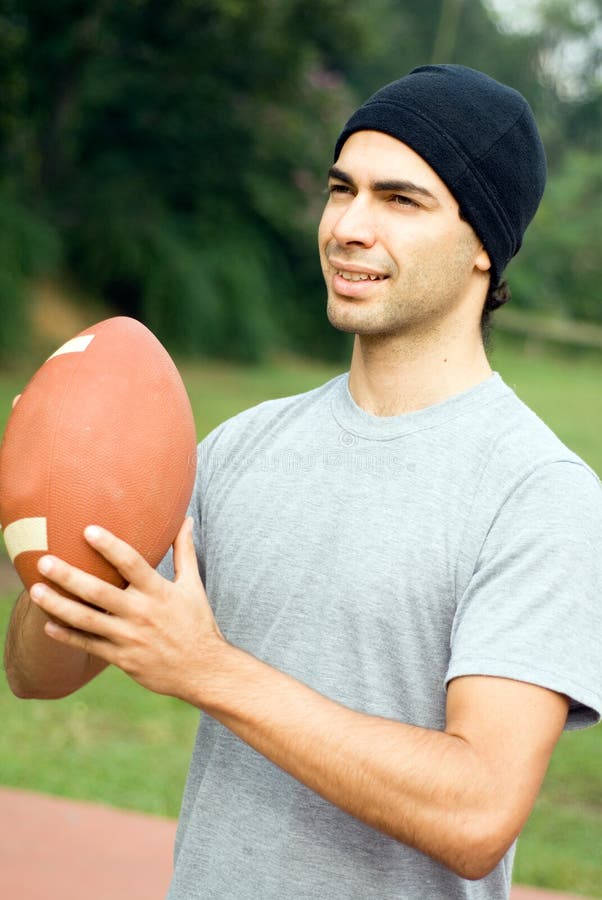 Man Holding Football - Vertical Stock Image - Image of peaceful, adult ...