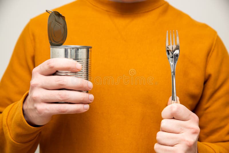 Man Holding a Fork and Opened Tin Can Stock Image - Image of metal ...