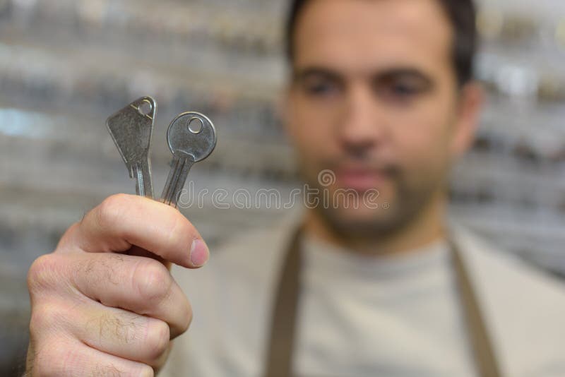 Man Holding Forward Two Keys Stock Image - Image of hold, male: 262700869