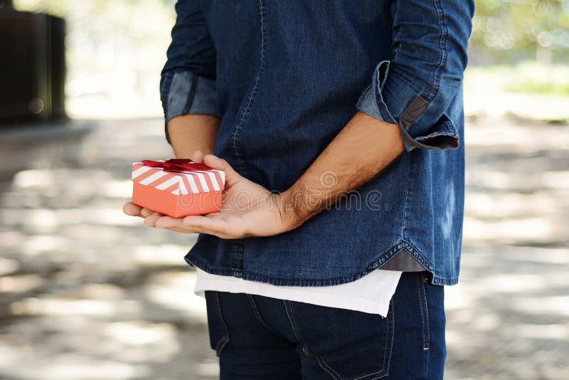 Man Holding a Gift Box Behind His Back. Stock Image - Image of hand ...