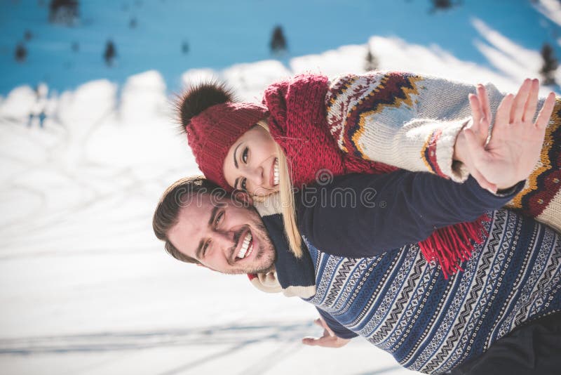 Man Holding Girlfriend on His Back at the Top of Mountain Stock Image ...
