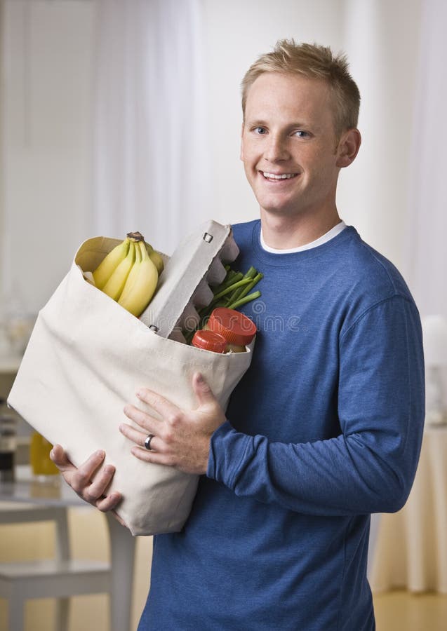 Man Holding Groceries stock photo. Image of stove, caucasian - 10185348