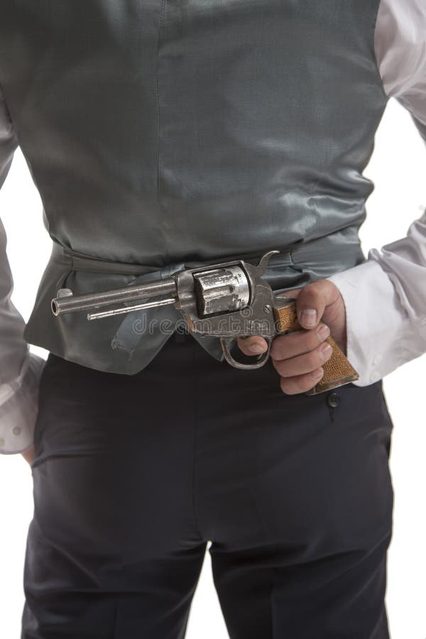 Man Holding a Gun Behind His Back Stock Image - Image of black, gloves ...