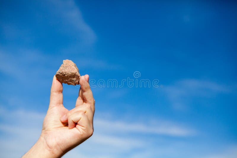 Hand holding rock stock photo. Image of palaeontology - 18465878