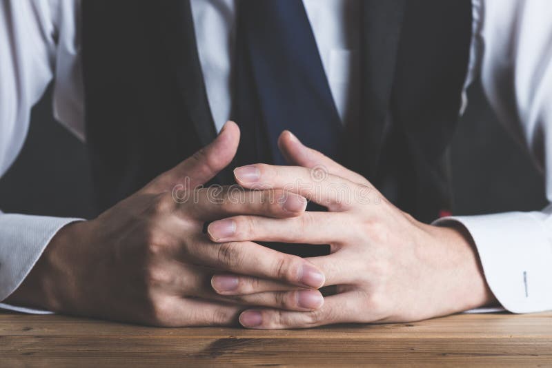 A Man Holding a Hand at the Table Stock Photo - Image of iamge ...