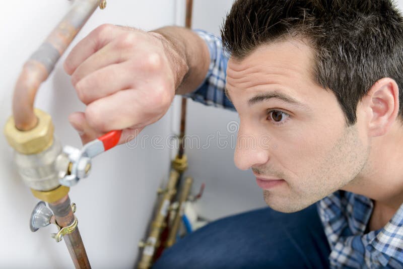 Man Holding Handle on Copper Pipe Stock Photo - Image of handle, open ...