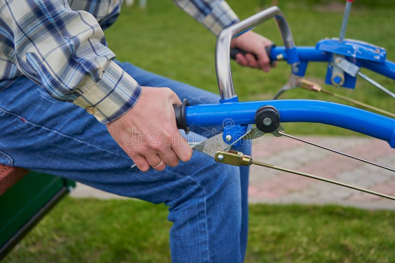 Man Holding the Handle of a Walk-behind Tractor, Close-up of a Hand ...