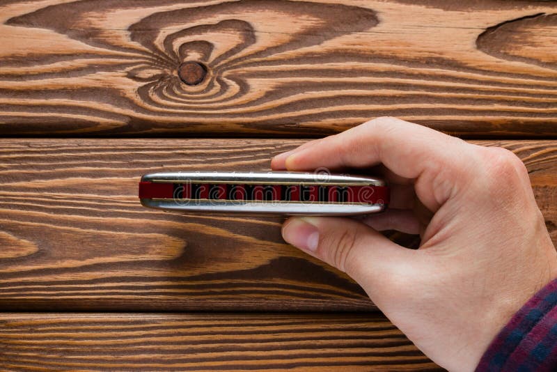 Harmonica in hand stock image. Image of close, chrome - 24351233