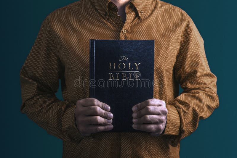 Man holding the Bible stock image. Image of scripture - 95723679