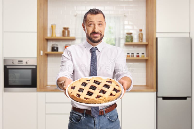Man holding a homemade pie stock photo. Image of homemade - 343728016