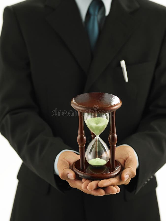 Man holding an hourglass stock photo. Image of pass, white - 8032994 Man holding an hourglass stock photo. Image of pass, white - 8032994