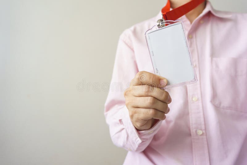 Man holding id card. stock photo. Image of attachment - 103048106