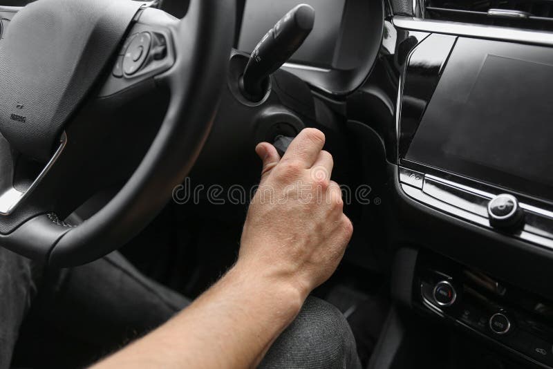 MAN HOLDING IGNITION KEY stock photo. Image of automotive - 255025868