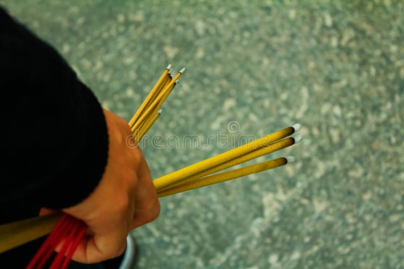 A Man Holding Incense Sticks. Preparing To Worship with Burning Incense ...