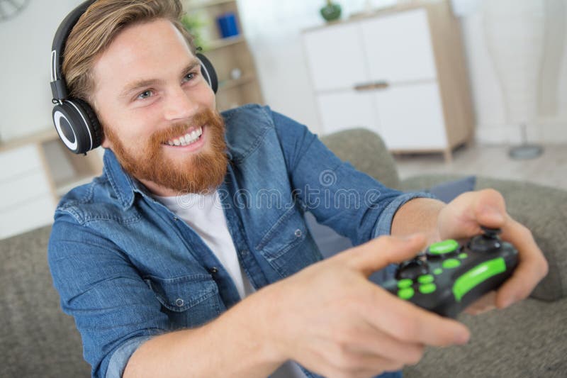 Man Holding Joystick Controller while Playing Video Games Stock Photo ...