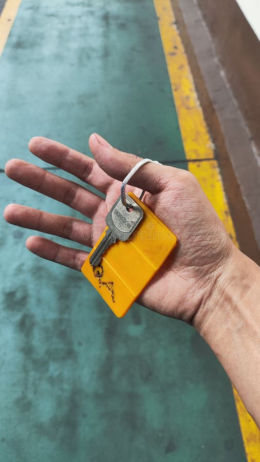 Man Holding a Key with His Finger Editorial Photography - Image of ...