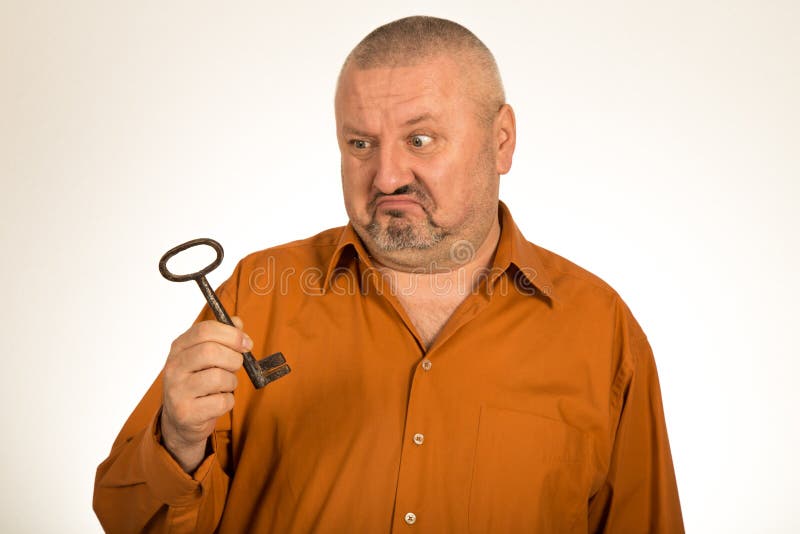 A Man Holding a Key To Success Stock Image - Image of businessman ...