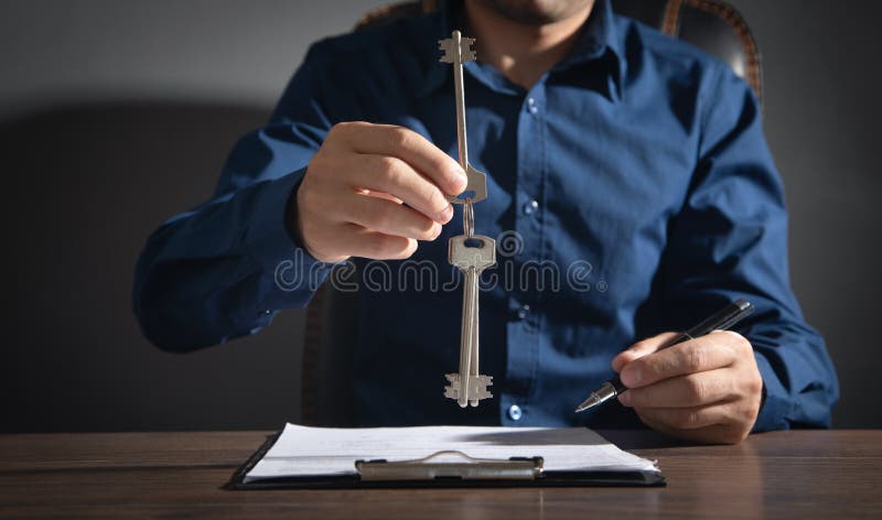 Man Holding Keys and Signing Contract Stock Photo - Image of agreement ...