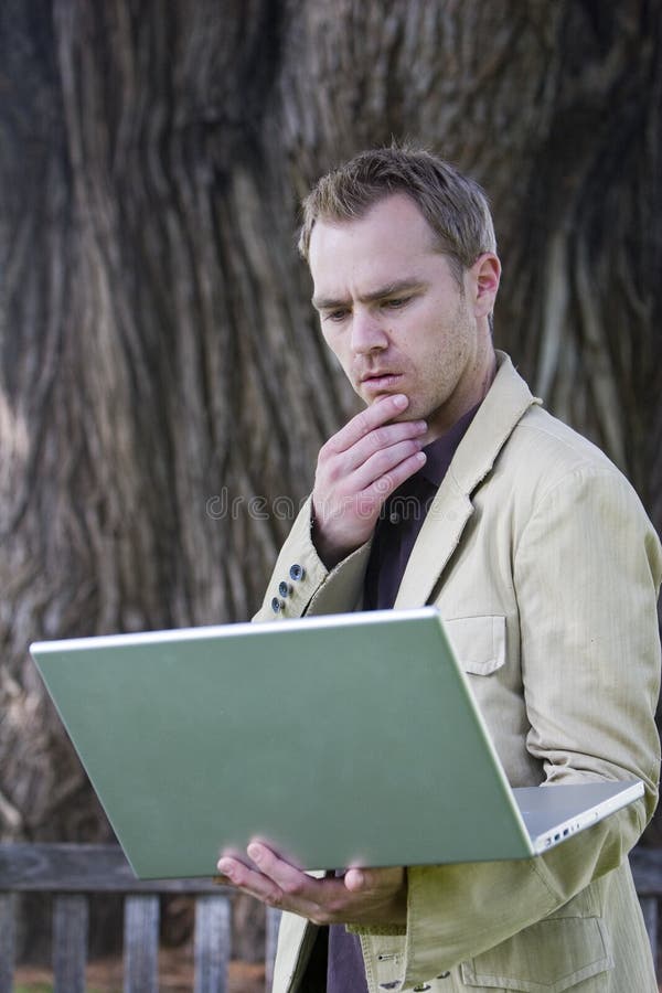 Man Holding Laptop Computer Stock Photo - Image of work, outdoor: 9812578
