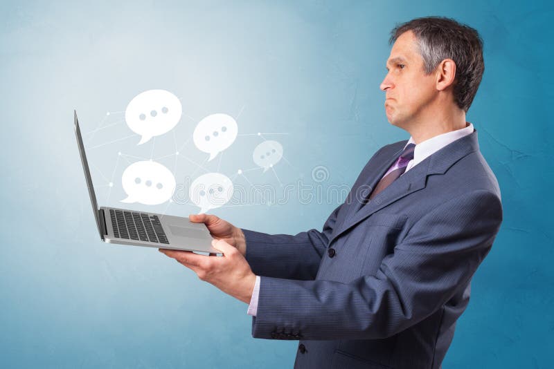 Man Holding Laptop with Speech Bubbles Stock Photo - Image of icon ...